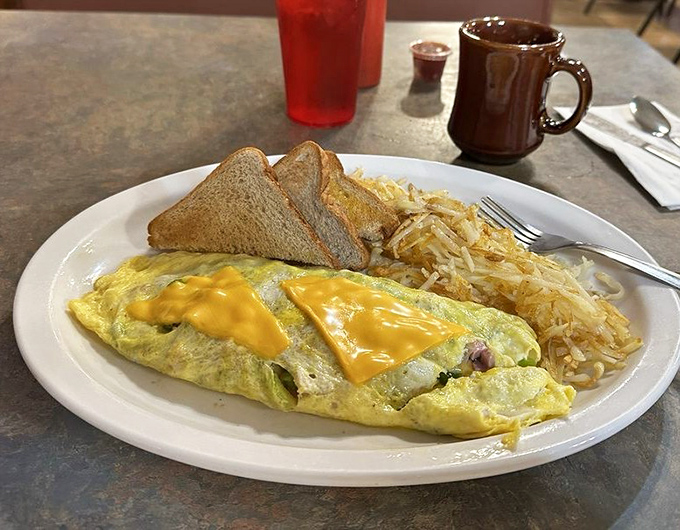Western omelet with hash browns and toast—the breakfast trifecta that's fueled Ohio mornings since before your grandparents' first date.