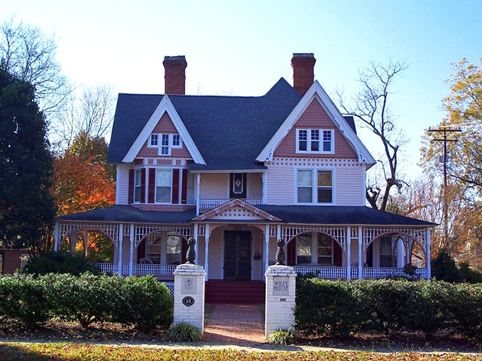 The Wiley House showcases Victorian charm with its intricate woodwork and welcoming porch. If these walls could talk, they'd tell tales of generations.