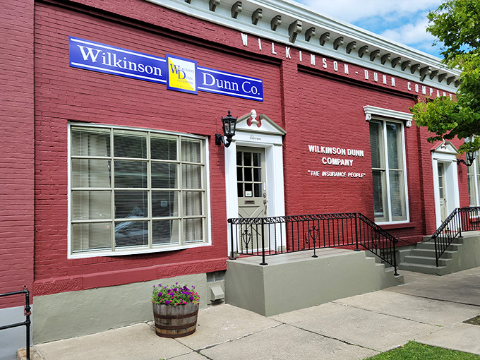 The Wilkinson-Dunn Company's vibrant red fa&ccedil;ade and classic signage remind us that local businesses once took pride in their storefronts' appearance.