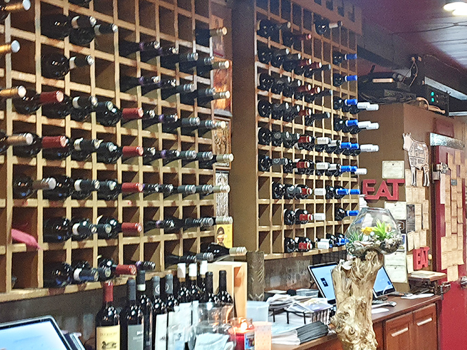 A wine wall that makes choosing your bottle feel like you've stumbled into a delicious library where every selection tells a different story.