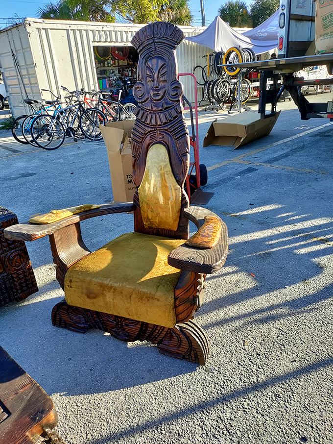 Hand-carved tiki chair commands attention, proving that furniture can be both functional art and conversation starter.