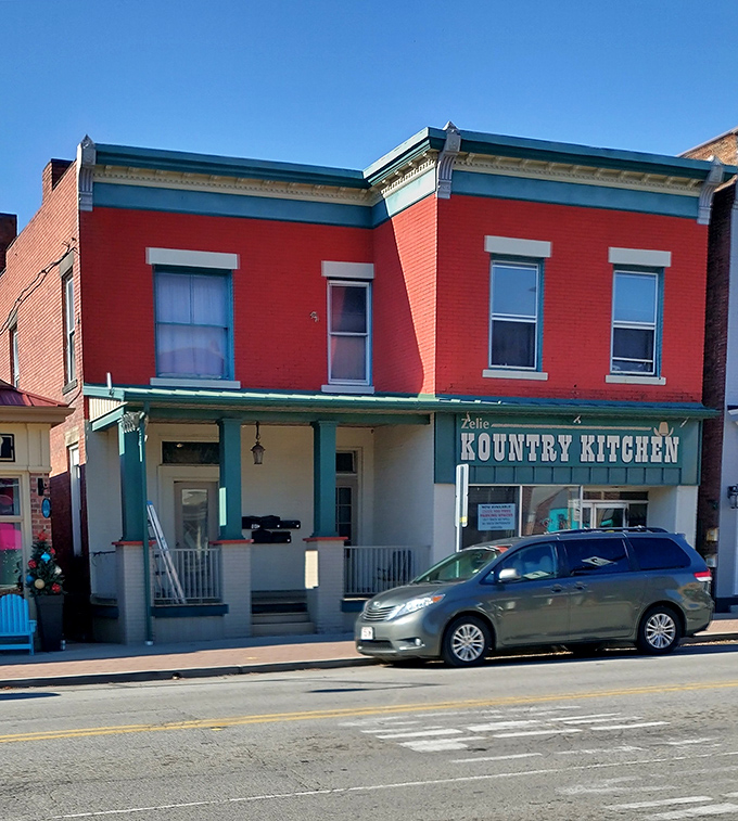 Zelie Kountry Kitchen's vibrant red facade promises the kind of breakfast where pancakes arrive the size of hubcaps and nobody's counting calories.