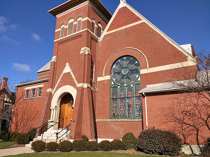 Zion Lutheran's stunning stained glass window catches the sunlight like a jewel. Architectural beauty that's been inspiring the faithful for generations.