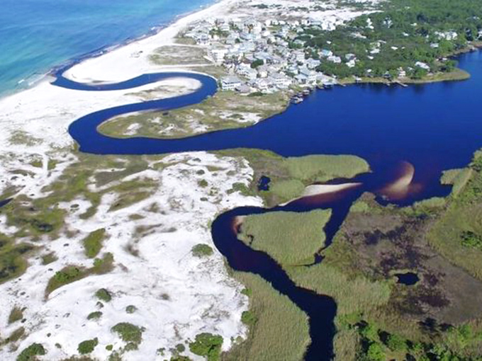 Nature's perfect swirl of blues and greens. This aerial view reveals why coastal dune lakes are among Earth's rarest and most beautiful ecosystems.