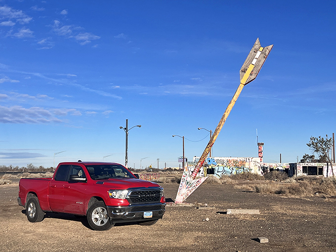 Red truck meets red arrow in a color-coordinated moment that would make any Instagram influencer weep.