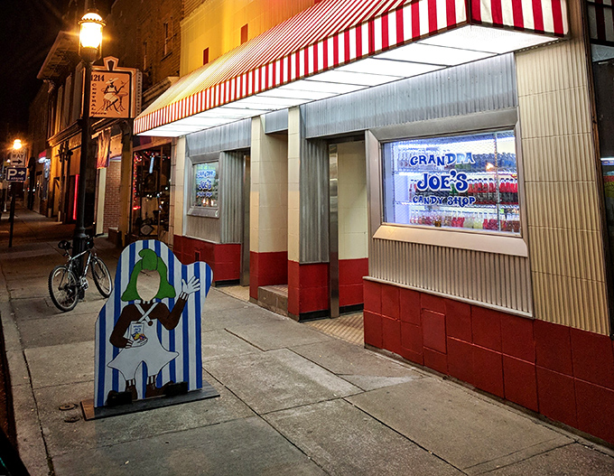 By night, the storefront glows like a beacon for sweet-toothed night owls and dessert emergency situations.