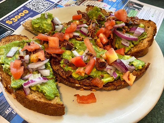 Avocado toast that doesn't require a second mortgage. Those red onions and tomatoes add pops of flavor that make your taste buds do a happy dance.