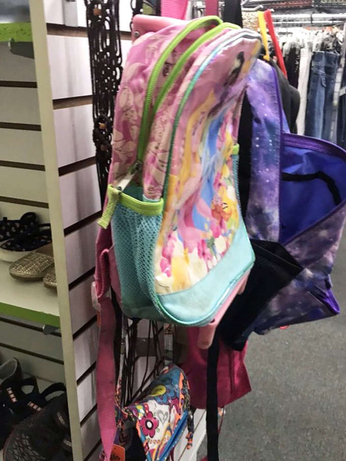 Backpack bonanza for the budget-conscious parent. School supplies and childhood essentials line these walls with colorful, practical options.