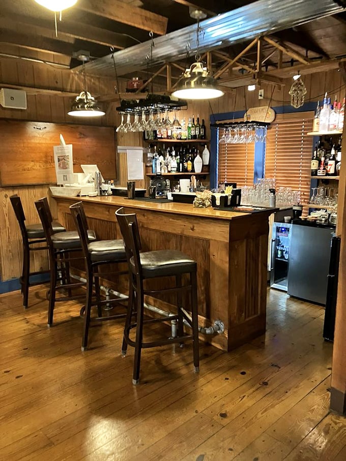 The bar area feels like the captain's quarters of a well-appointed sailing vessel, where nautical charm meets serious cocktail craftsmanship.