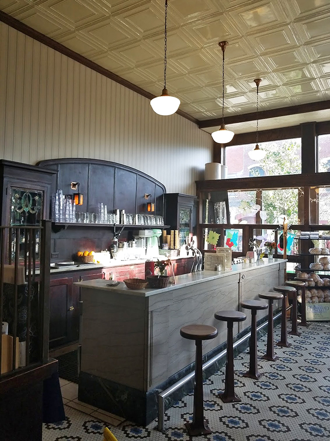 The soda fountain counter—where magic happens at the hands of modern-day alchemists turning simple ingredients into frothy, fizzy treasures beneath those vintage pendant lights.