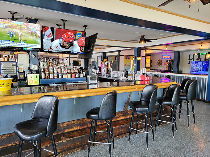 The bar area invites lingering conversations over craft cocktails while Lake Erie provides the ultimate backdrop entertainment.