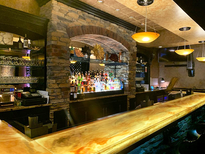 The bar area combines rustic stone with modern touches, creating a welcoming space to enjoy a pre-dinner cocktail or digestivo.
