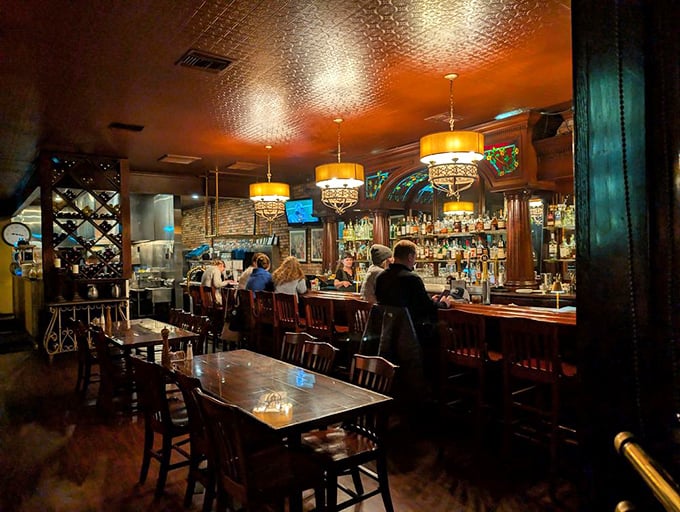 A bar that balances elegance with accessibility. Those pendant lights cast the kind of glow that makes everyone look like they're in a food commercial.