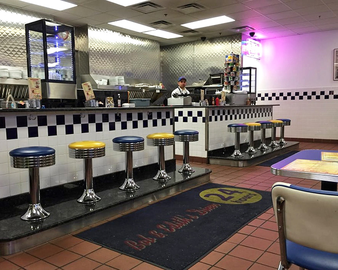 The counter where diner magic happens. Those blue and yellow stools have heard more stories than a bartender on New Year's Eve.