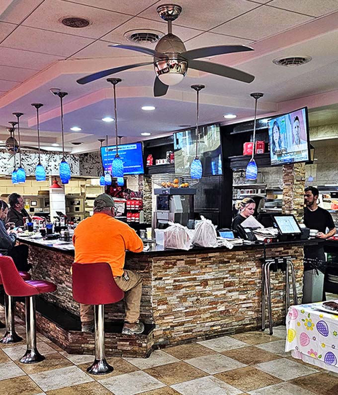 The command center where coffee flows like a caffeinated river and locals solve crosswords between refills.