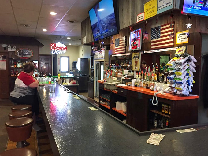 The bar counter where locals solve world problems over cold beer and hot chicken.
