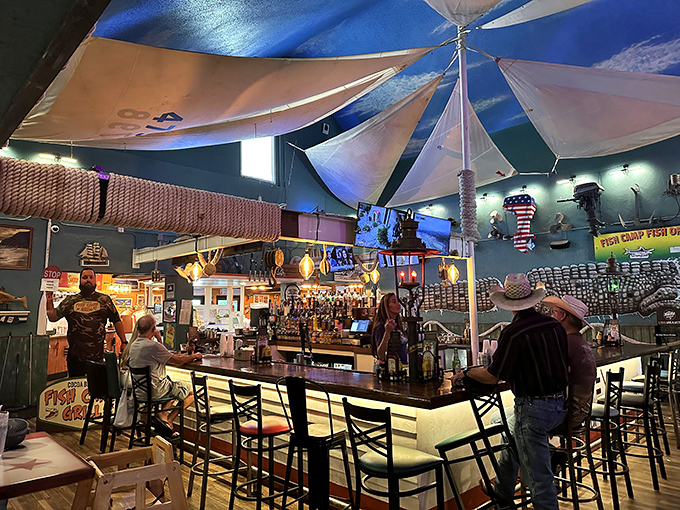 Under sailcloth canopies, the bar feels like you've stepped aboard a quirky fishing vessel that happens to serve exceptional cocktails.