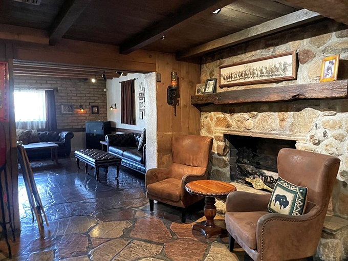 The lounge area beckons with leather chairs and a stone fireplace&mdash;the kind of spot where you linger long after your plate is clean.