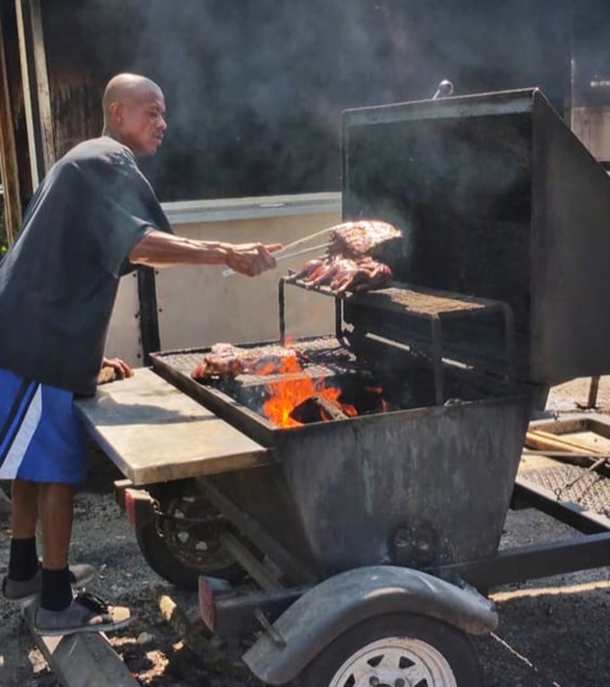 The open flame tells no lies. This is barbecue in its most honest form &ndash; direct heat, smoke, meat, and the skilled hands of someone who respects all three.