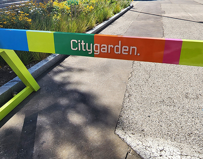 Citygarden's rainbow-hued barriers are artworks themselves. Even the functional elements here refuse to be boring, bringing playful color to the urban landscape.