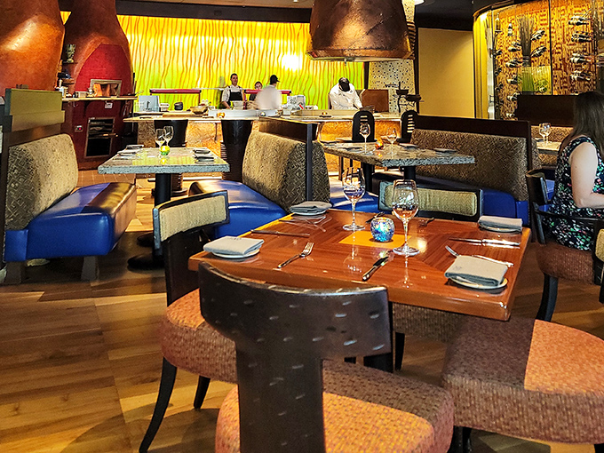 Booth seating designed for lingering conversations over multiple courses and countless wine refills together.