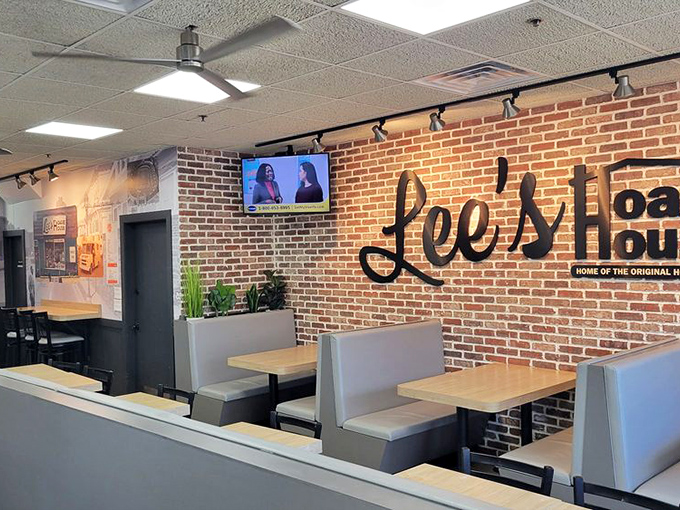 Modern booths against classic brick walls – Lee's evolves while honoring tradition. The perfect setting for serious sandwich consumption.