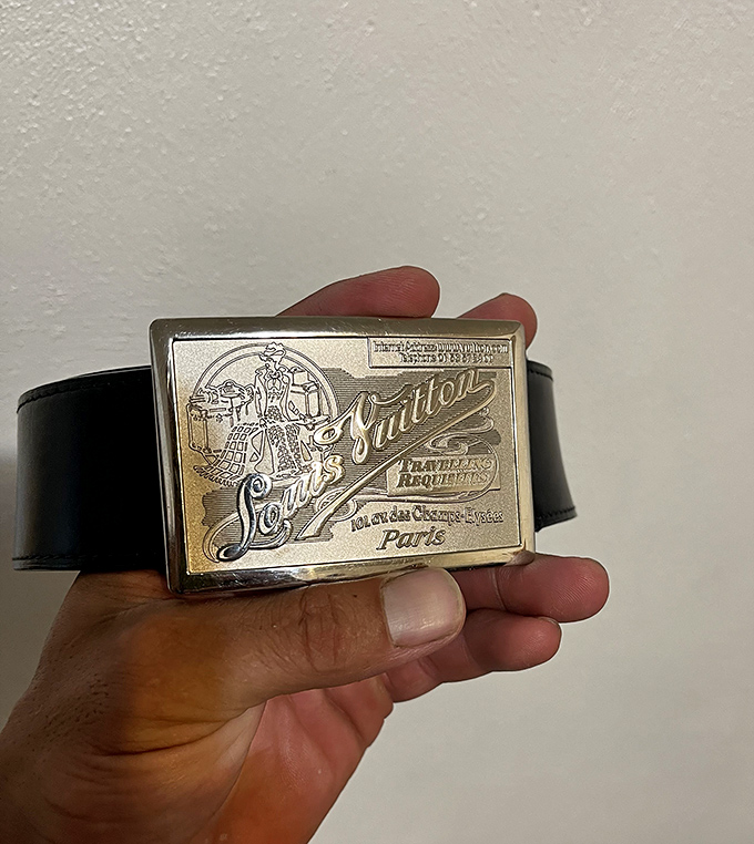 This authentic Louis Vuitton belt buckle showcases the craftsmanship that makes designer pieces worth hunting for at consignment prices.