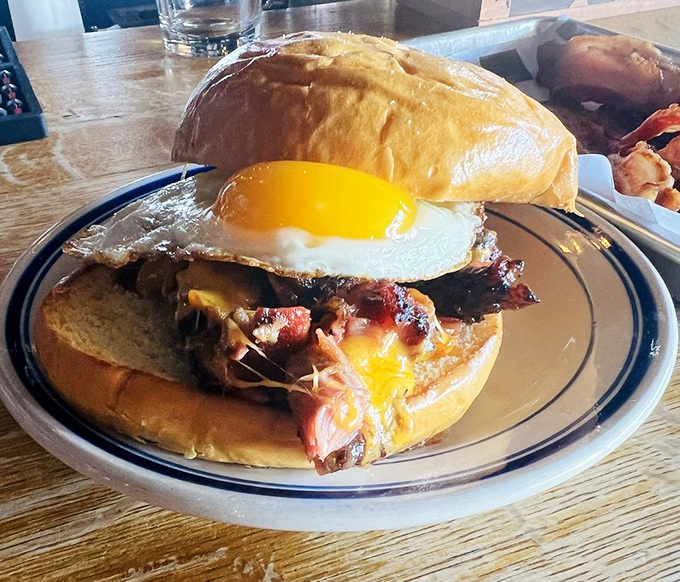 The breakfast sandwich that makes morning people out of night owls. Runny egg meets smoky meat on a soft bun&mdash;a sunrise symphony of flavors.