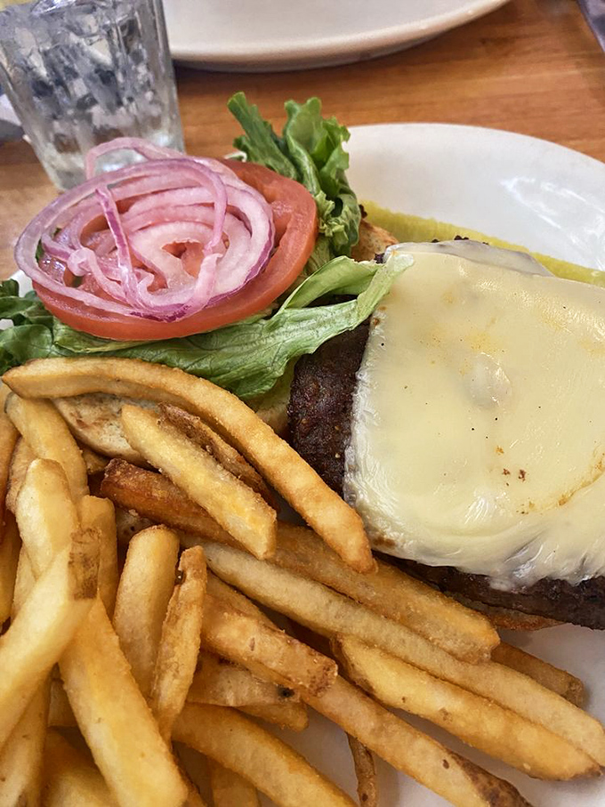A burger that understands the importance of proper cheese-to-meat ratio. Those fries look like they've achieved the golden ideal of crispness.