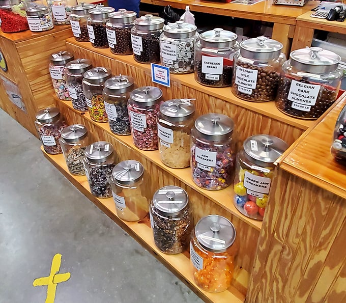 Candy jars filled with sweet temptations line wooden shelves. Like being a kid again, but now you can buy the whole jar without parental permission.