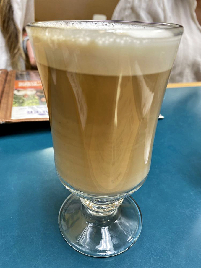 Coffee elevated beyond utility to small pleasure. That foam isn't just milk – it's the difference between fueling up and dining well.