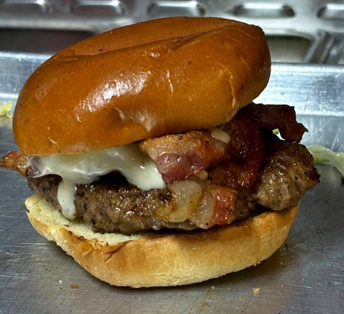 This isn't just a burger—it's a tower of indulgence. The melted cheese and bacon create a savory symphony that makes diets disappear.