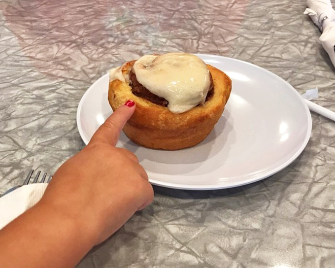 The cinnamon roll that demands to be pointed at. That cream cheese frosting isn't just a topping—it's the crown jewel of breakfast indulgence.