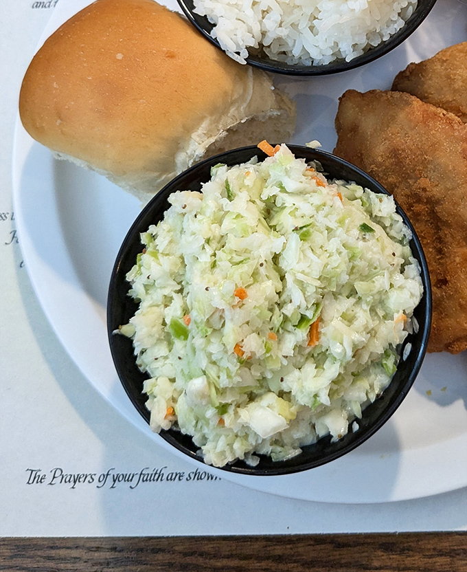 This isn't just coleslaw&mdash;it's a crisp, tangy counterpoint to the region's hearty fare, bringing balance to the culinary force.