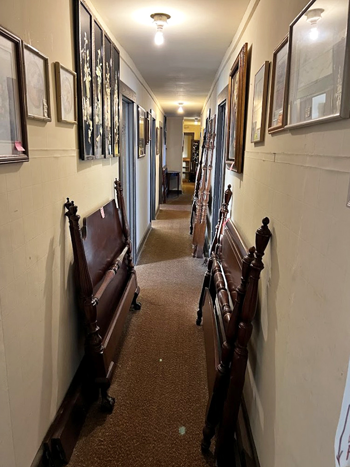 Narrow hallways lined with bed frames and artwork create the ultimate treasure hunt experience. Indiana Jones would get distracted in here.