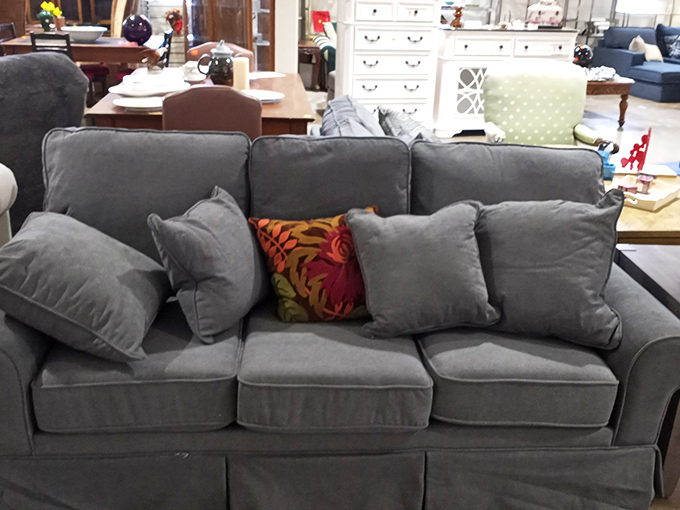 This gray sofa has seen things, but it's not telling. With fresh pillows and a throw blanket, it's ready for its redemption story in your living room.