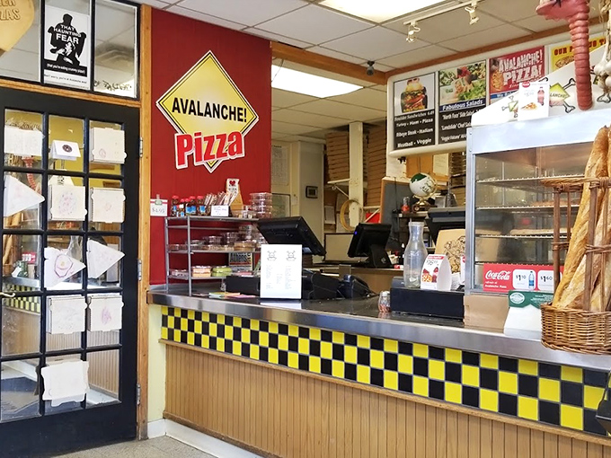 The checkered counter where pizza dreams come true. This unassuming command center has launched thousands of delicious meals into the Athens community.