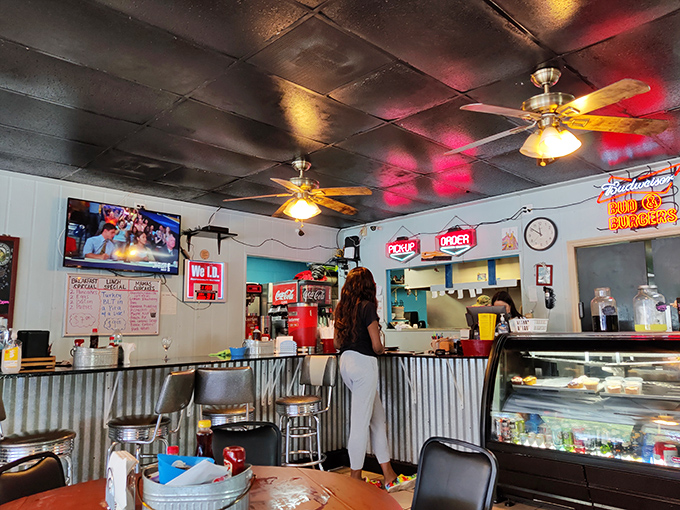 The counter where locals solve world problems over coffee while newcomers discover their new favorite spot.