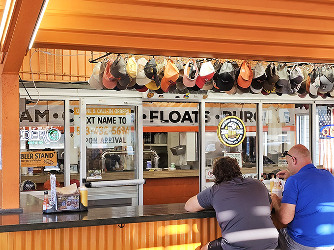 Counter seating puts you ringside for the culinary ballet of coneys, burgers, and root beer choreography.