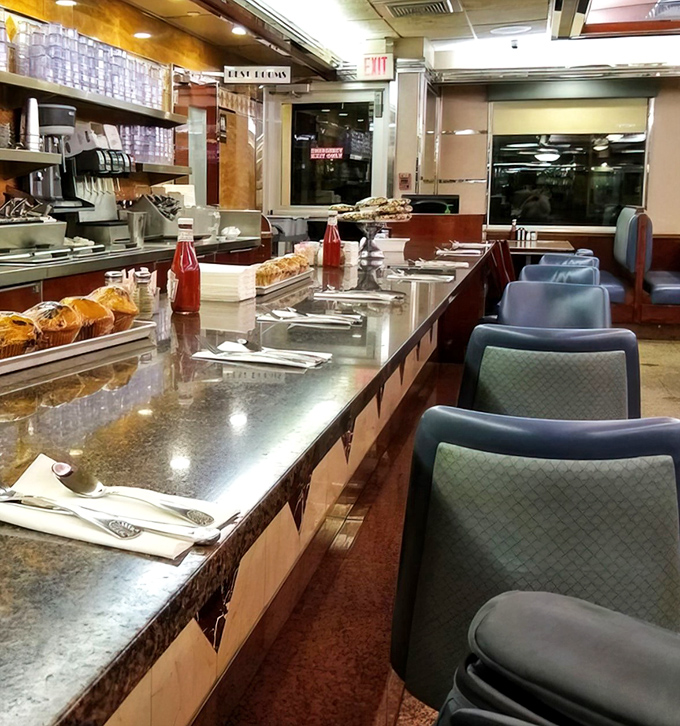 The counter seats offer front-row tickets to the short-order show, where breakfast becomes theater and coffee is always the opening act.