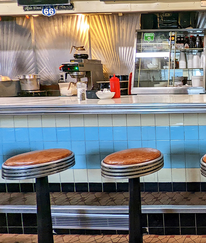 Those counter stools have witnessed first dates, business deals, and countless "just one more cup" moments. The blue-tiled counter gleams with possibilities.