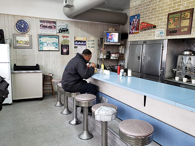 A solitary diner enjoys the ritual of a Mike's meal&mdash;a moment of culinary meditation in a busy world. Some come for the ham, others for the peace.