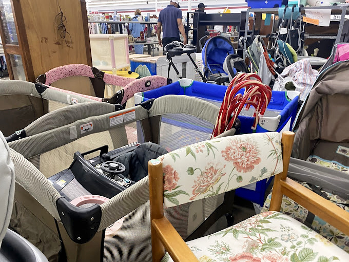 Baby gear galore! Gently-used cribs and high chairs await new families, proving kids outgrow things faster than wallets can keep up.