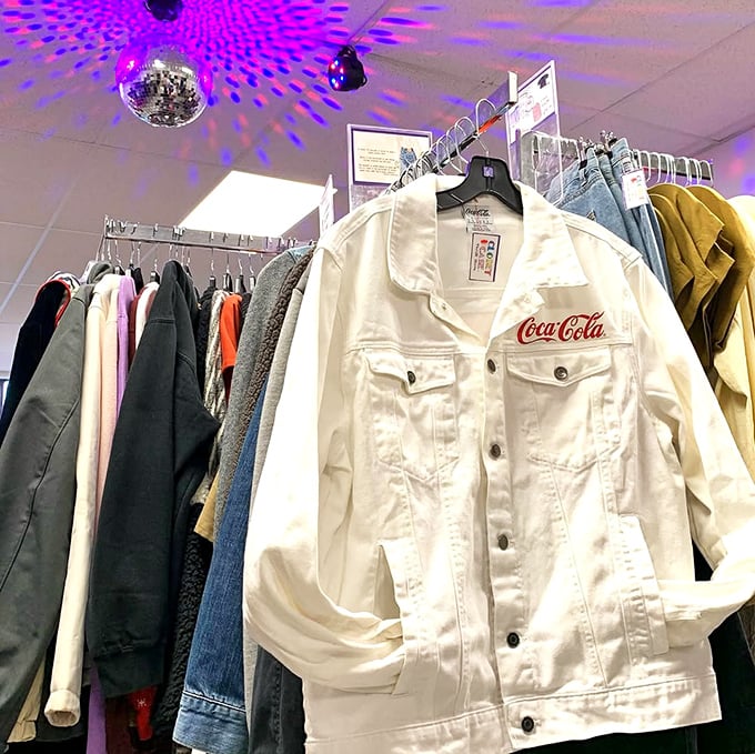 That Coca-Cola jacket isn't just clothing &ndash; it's wearable nostalgia hanging beneath disco ball lighting that makes everyday shopping feel like an event.