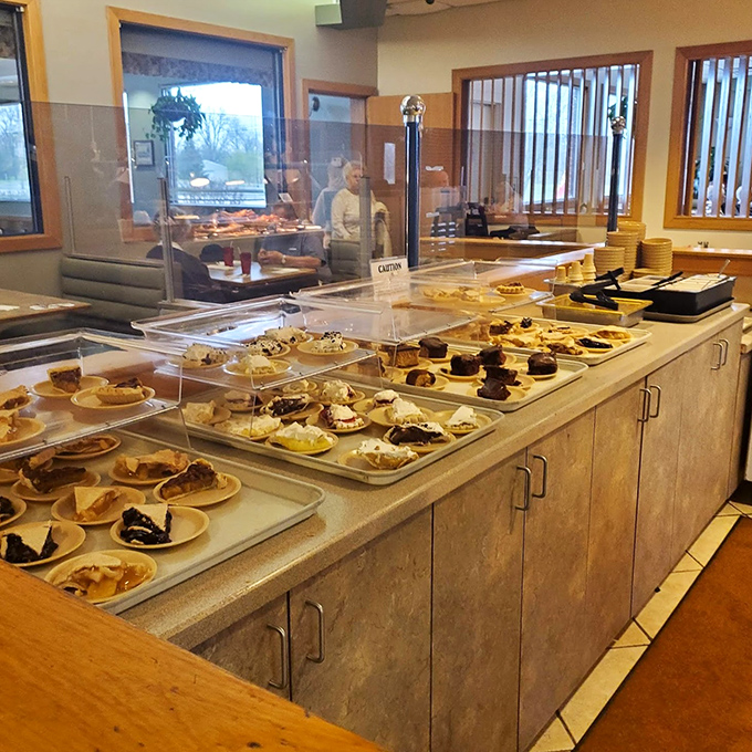 The dessert station stands ready like a sweet soldier, waiting to complete your dining mission perfectly.