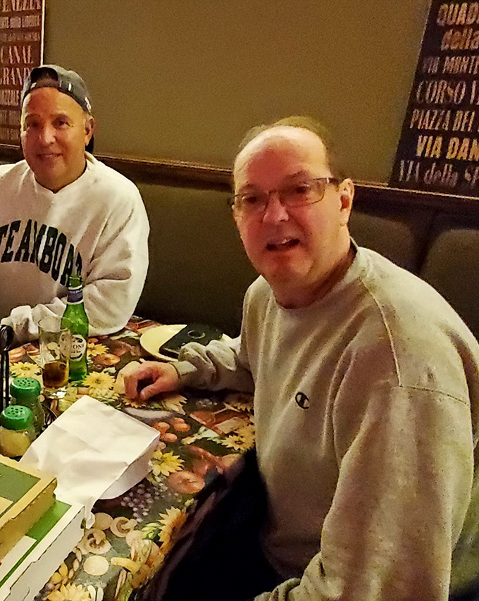 Regular customers become family at places like this. Those smiles say they've made the right decision about where to spend their evening.