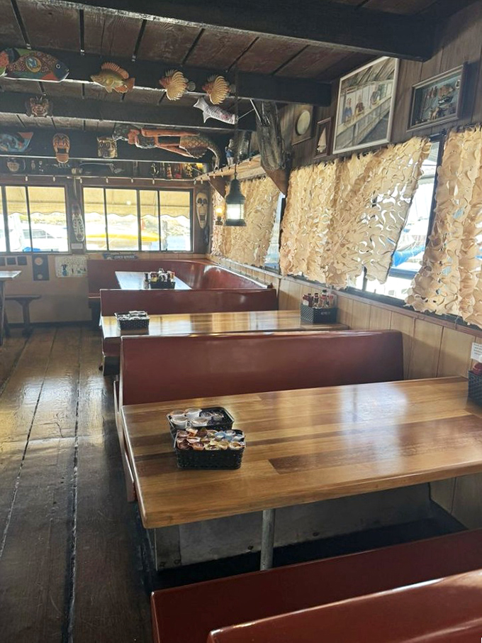 Booth seating that invites you to settle in and stay awhile. Those fish decorations overhead aren't just decor&mdash;they're setting expectations.