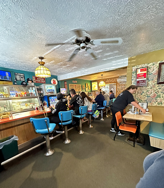 The lunch rush &ndash; a beautiful choreography of servers, diners, and comfort food, all under the watchful glow of vintage pendant lights.