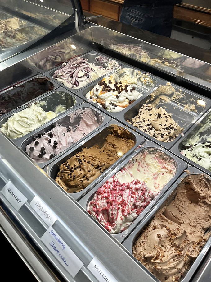 The gelato case—where adults press their noses against glass like kids at a toy store. Each flavor is a different vacation destination for your taste buds.