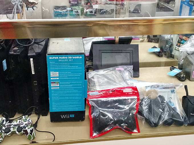 Gaming treasures behind glass&mdash;where nostalgic parents can introduce kids to the classics while secretly reliving their own button-mashing youth.